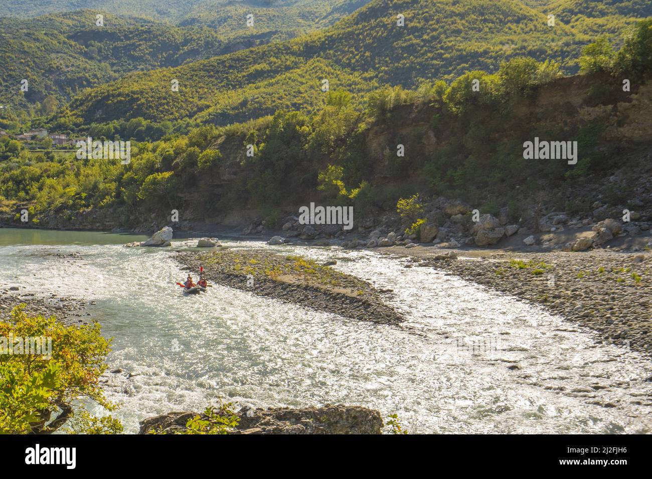 Rafting on a mountain river in Albania. These people are carrying out ...