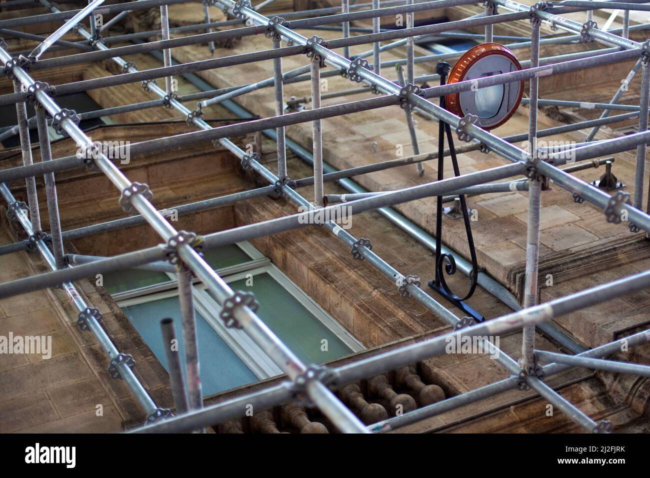 Scaffolding on an old stoned building Stock Photo - Alamy