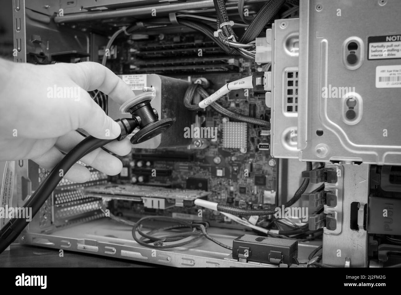 a stethoscope is held in a screwed-on pc Stock Photo - Alamy