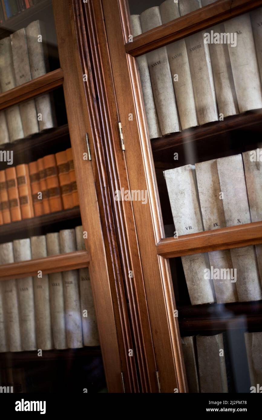 Wooden bookcase and old books Stock Photo - Alamy