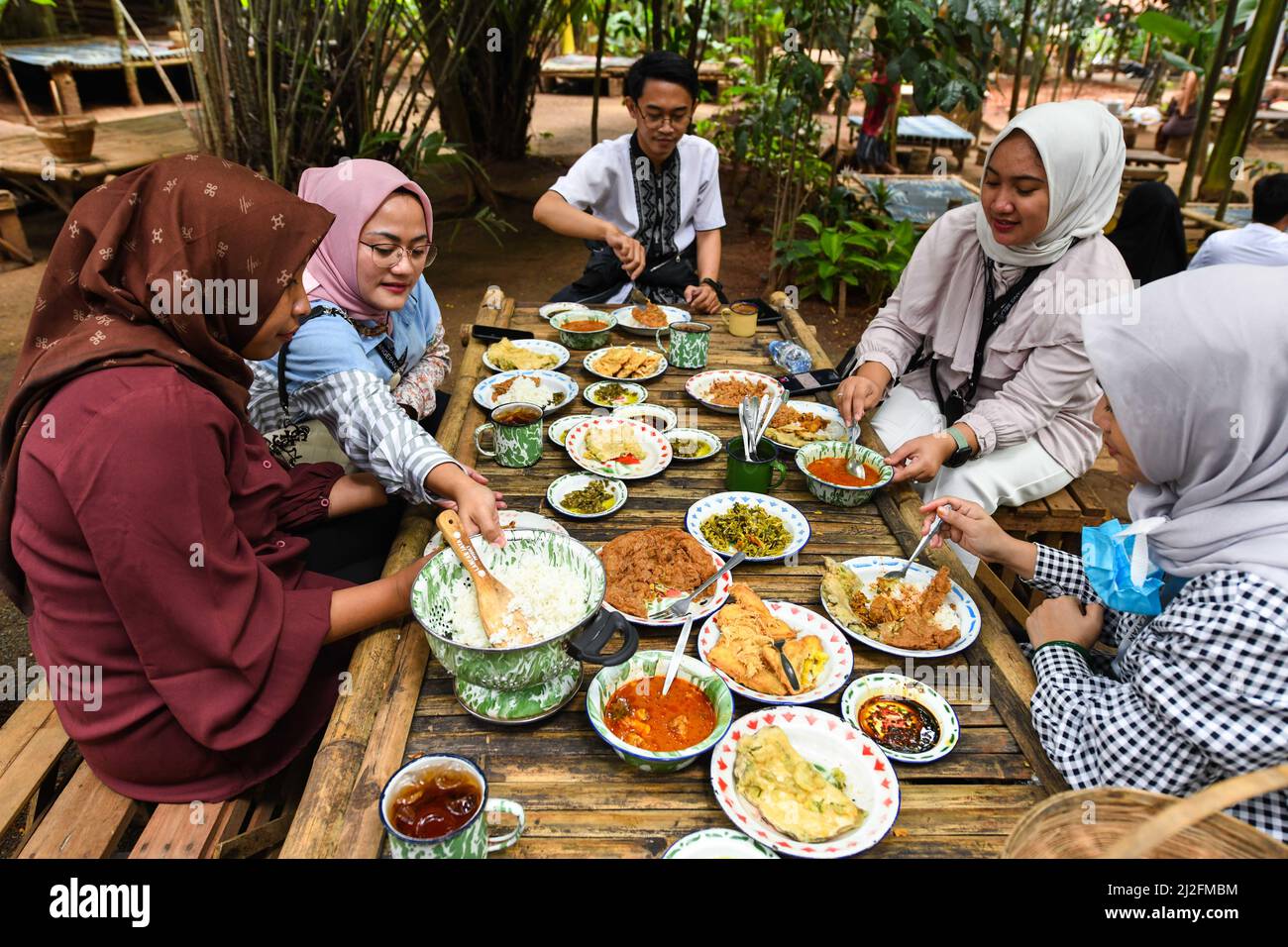 South Tangerang, Indonesia. 1st Apr, 2022. People dine at a restaurant ...