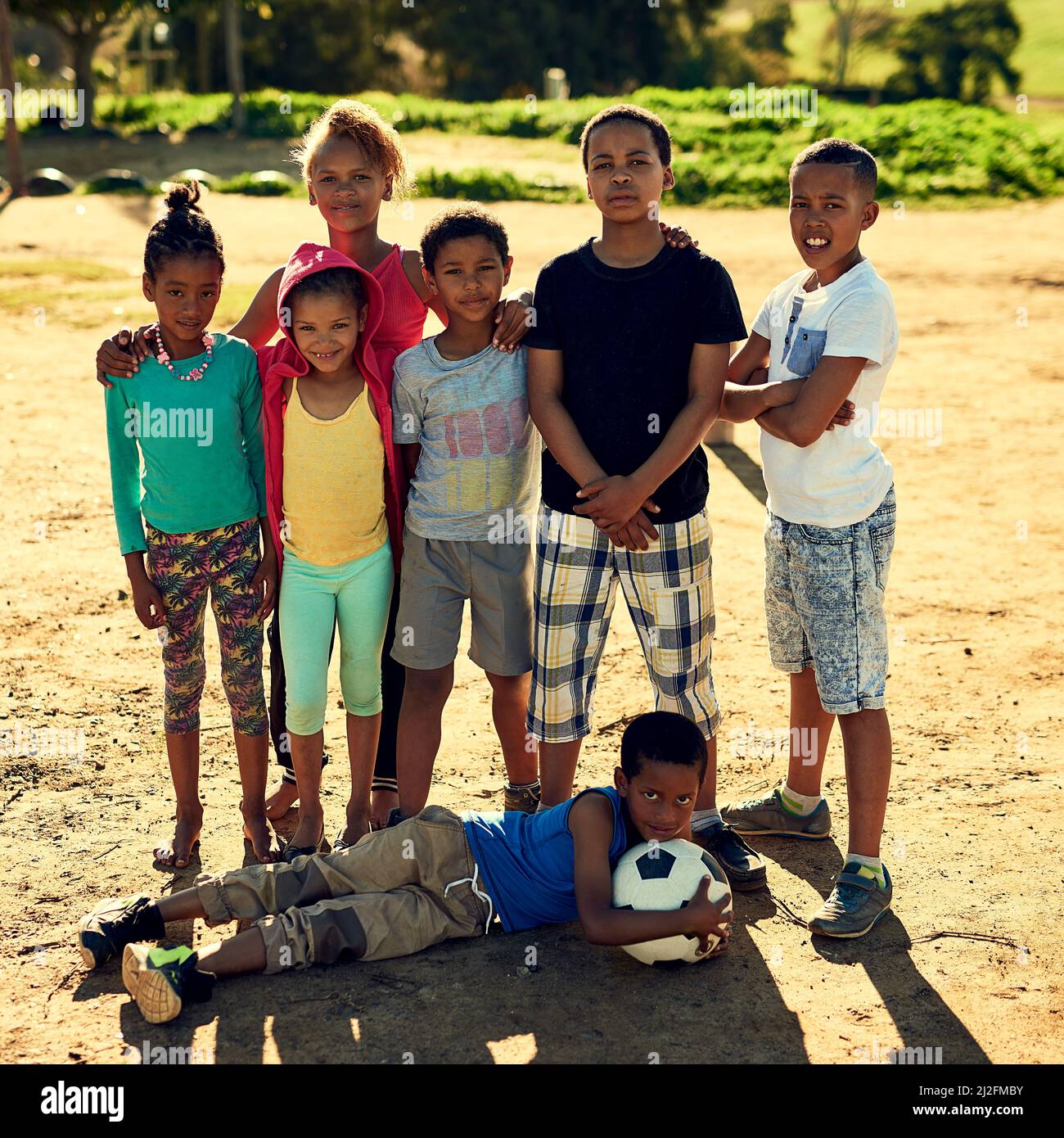 Time for some soccer. Portrait of a group of children standing together ...