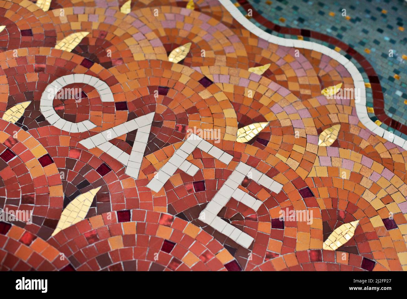 Mosaic on the floor of a French cafe Stock Photo - Alamy