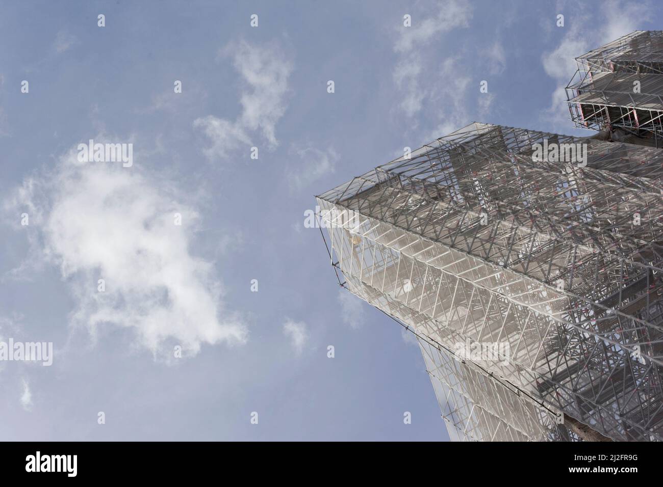 Scaffolding and blue sky on background Stock Photo - Alamy