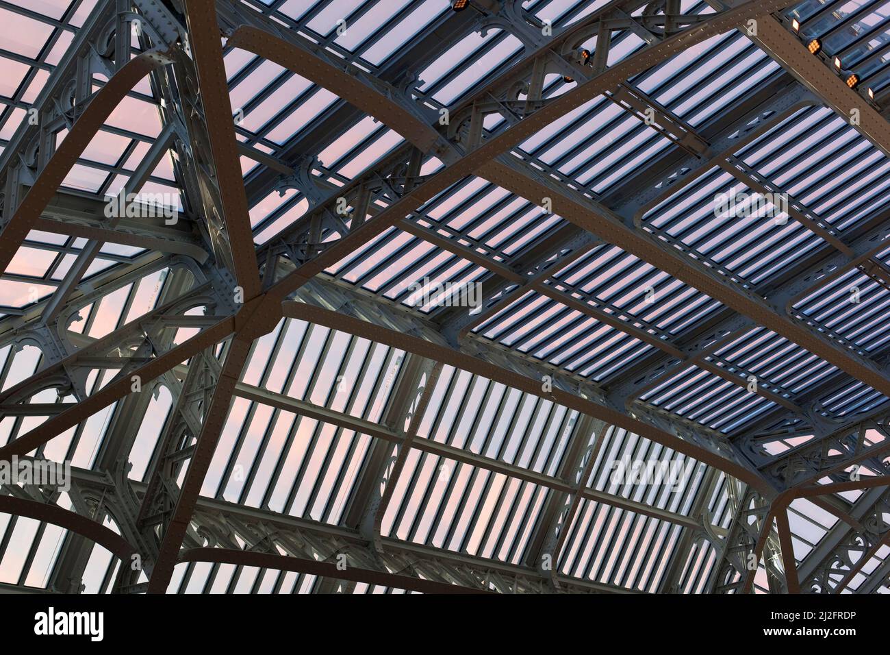 Iron glass roof inside a French building Stock Photo - Alamy