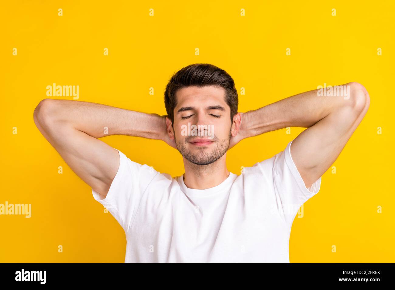 Photo of nice young brunet guy palms head wear white t-shirt isolated ...