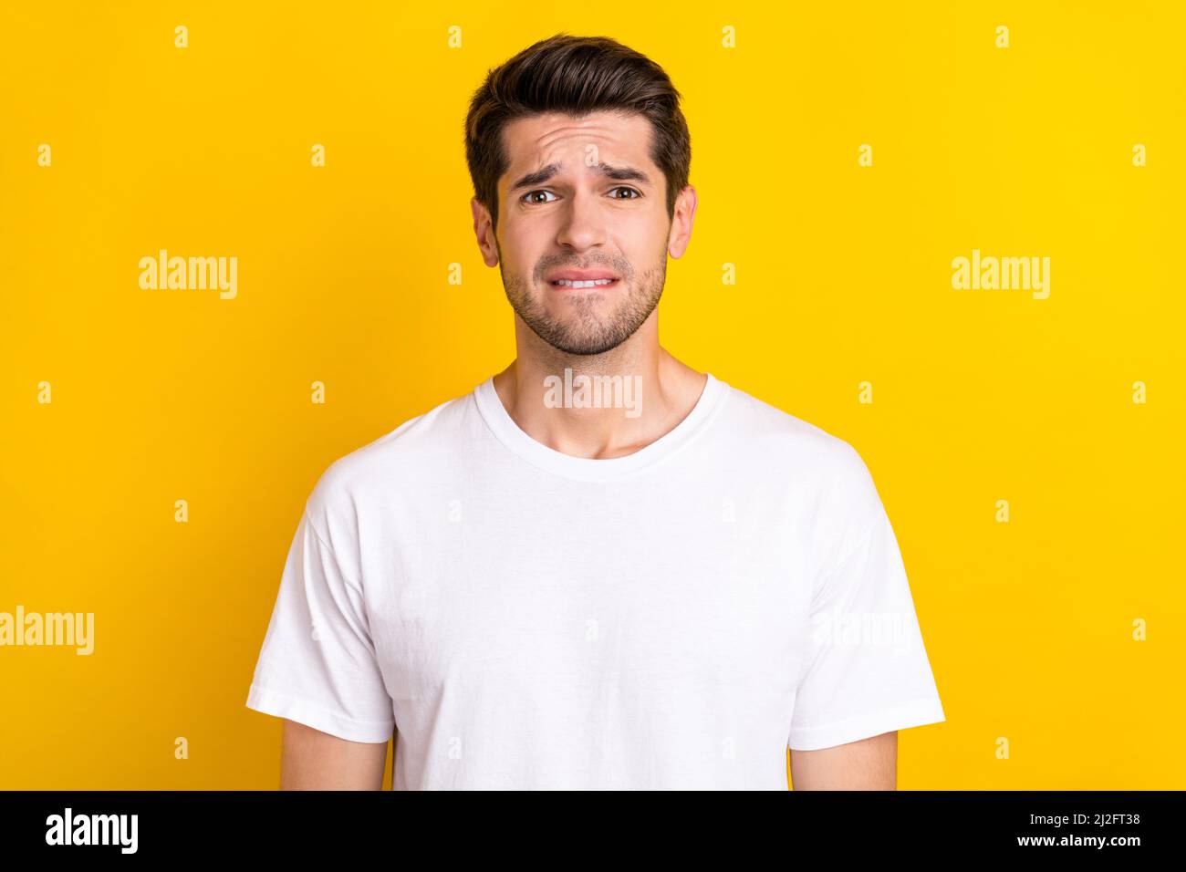 Photo of sorry worried nervous scared man bite lip look camera wear ...