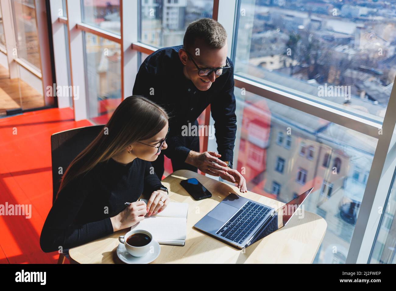 Successful business team, male and female colleagues talking at work ...