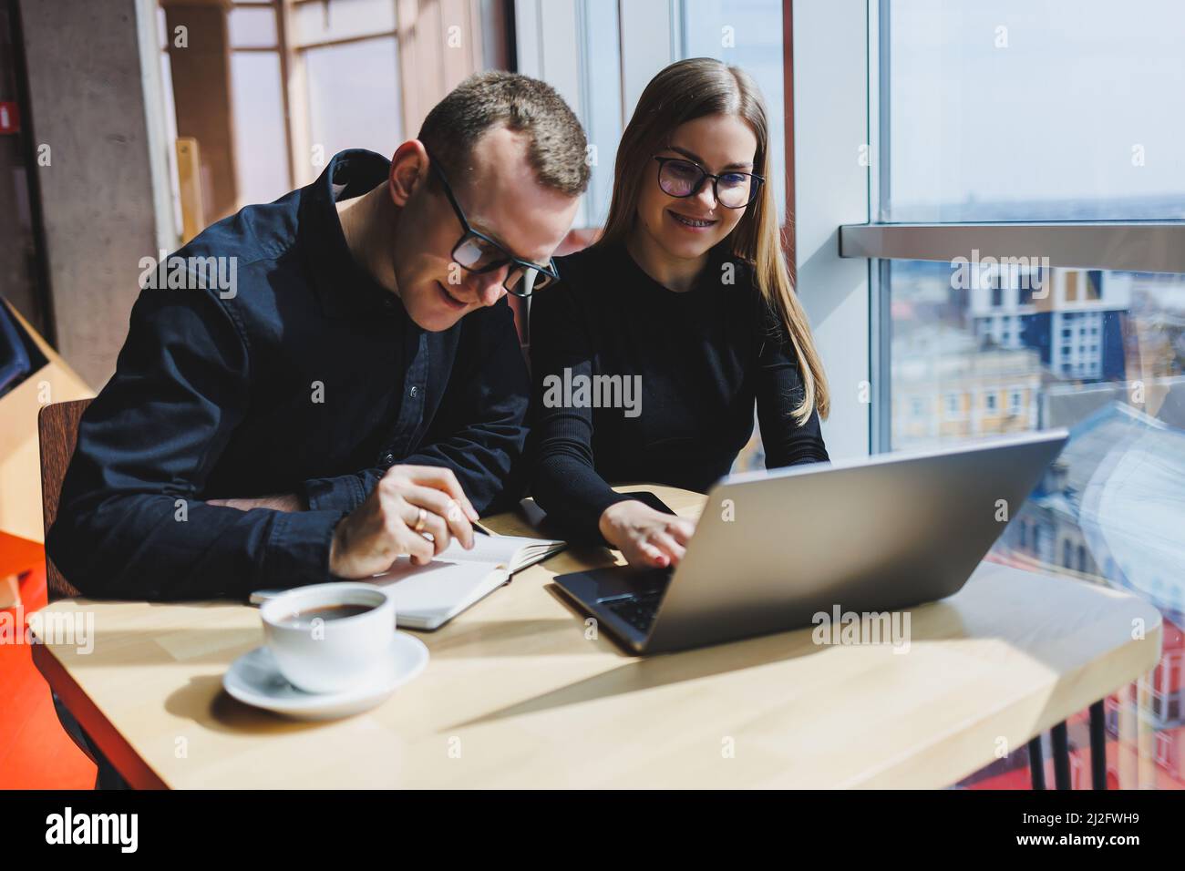 Successful business team, male and female colleagues talking at work ...