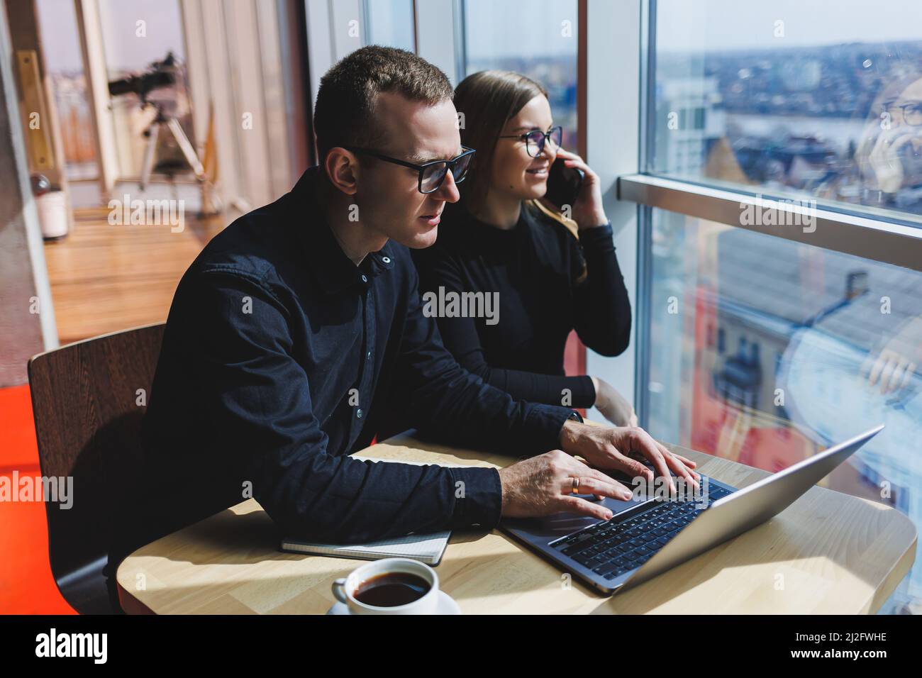 Successful business team, male and female colleagues talking at work, discussing a new project ...