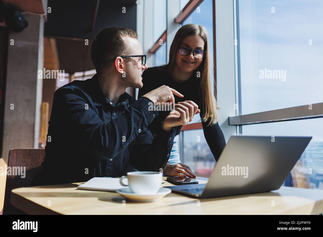 Happy business people are sitting at the table, talking, laughing ... Happy business people are sitting at the table, talking, laughing ...