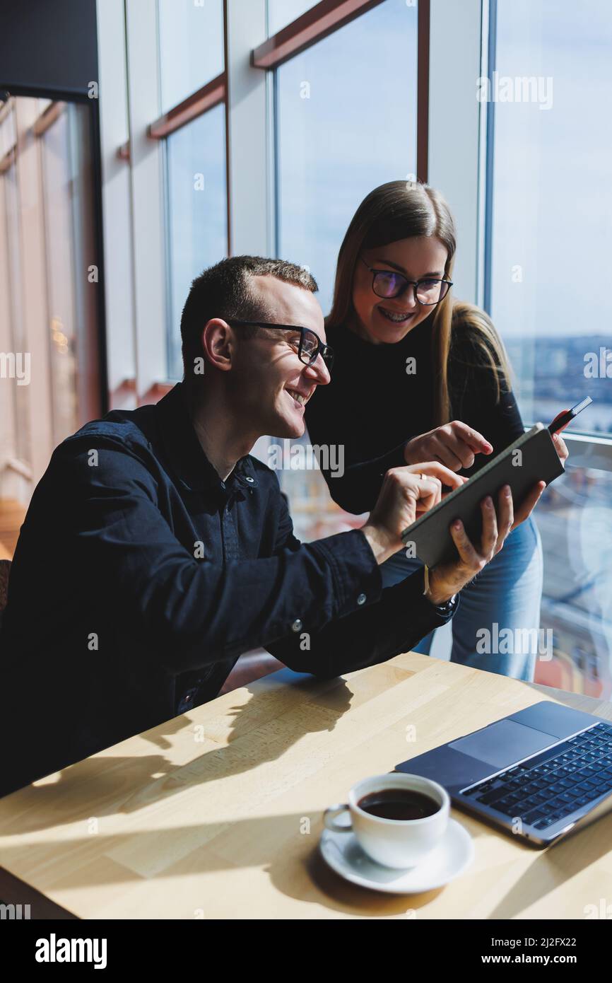 Successful business team, male and female colleagues talking at work ...