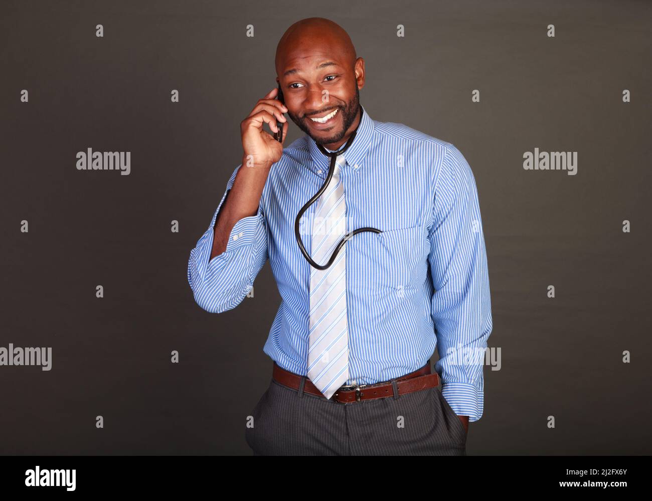 African American / Black doctor checking his cell phone Stock Photo - Alamy