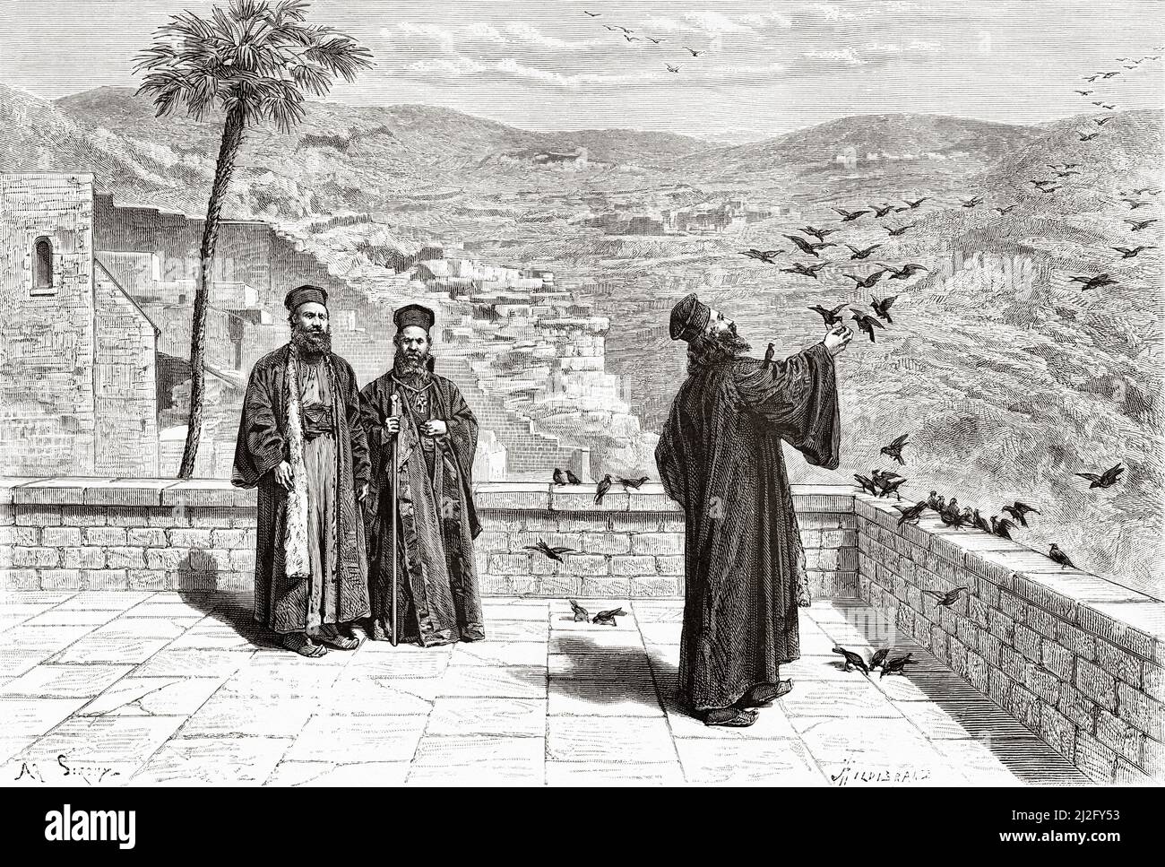 Monks feeding blackbirds at Mar Saba Greek Orthodox monastery, Kidron ...