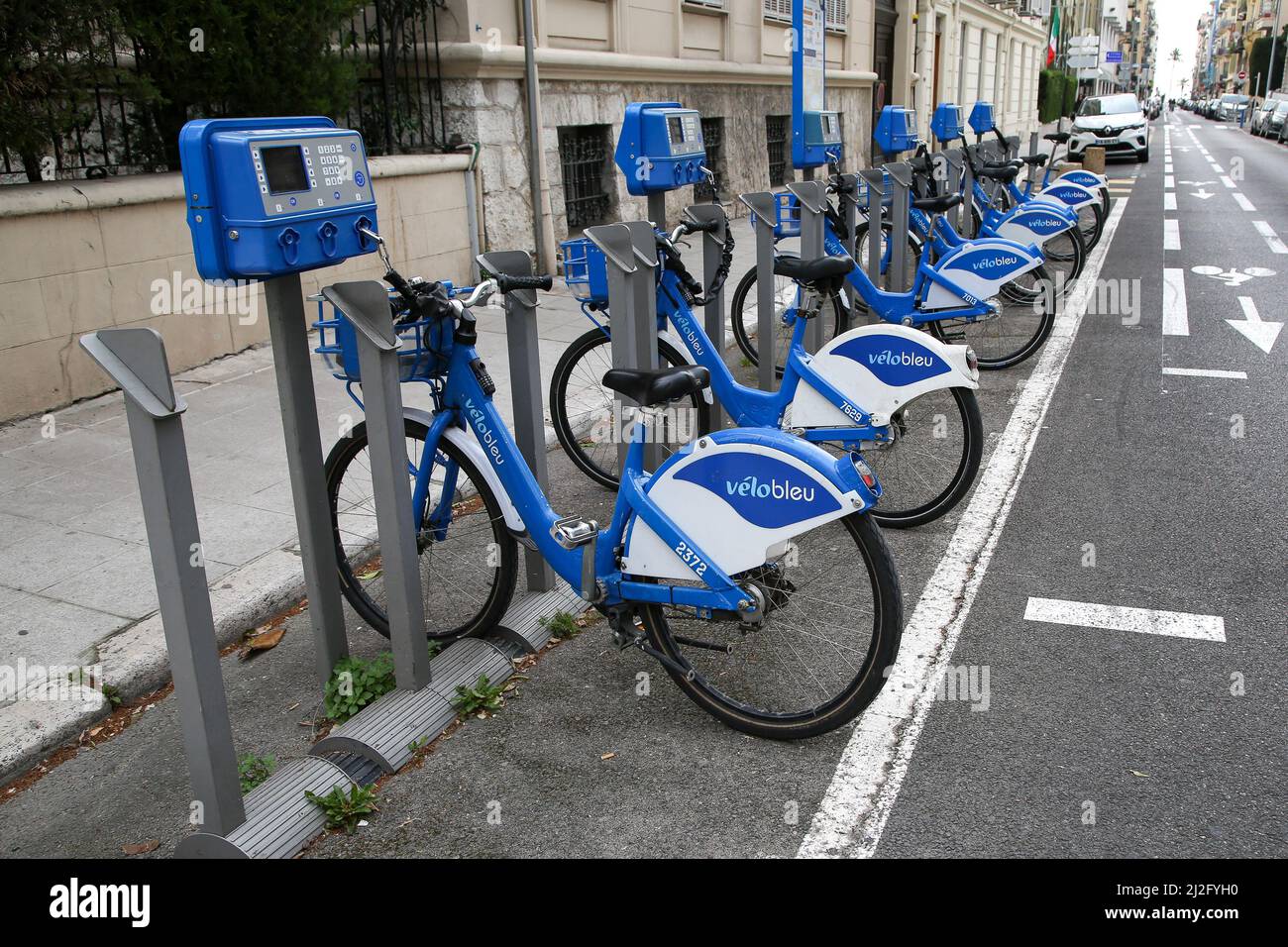 Electric bikes parked at a docking station. E-V lobleu is the rental ...