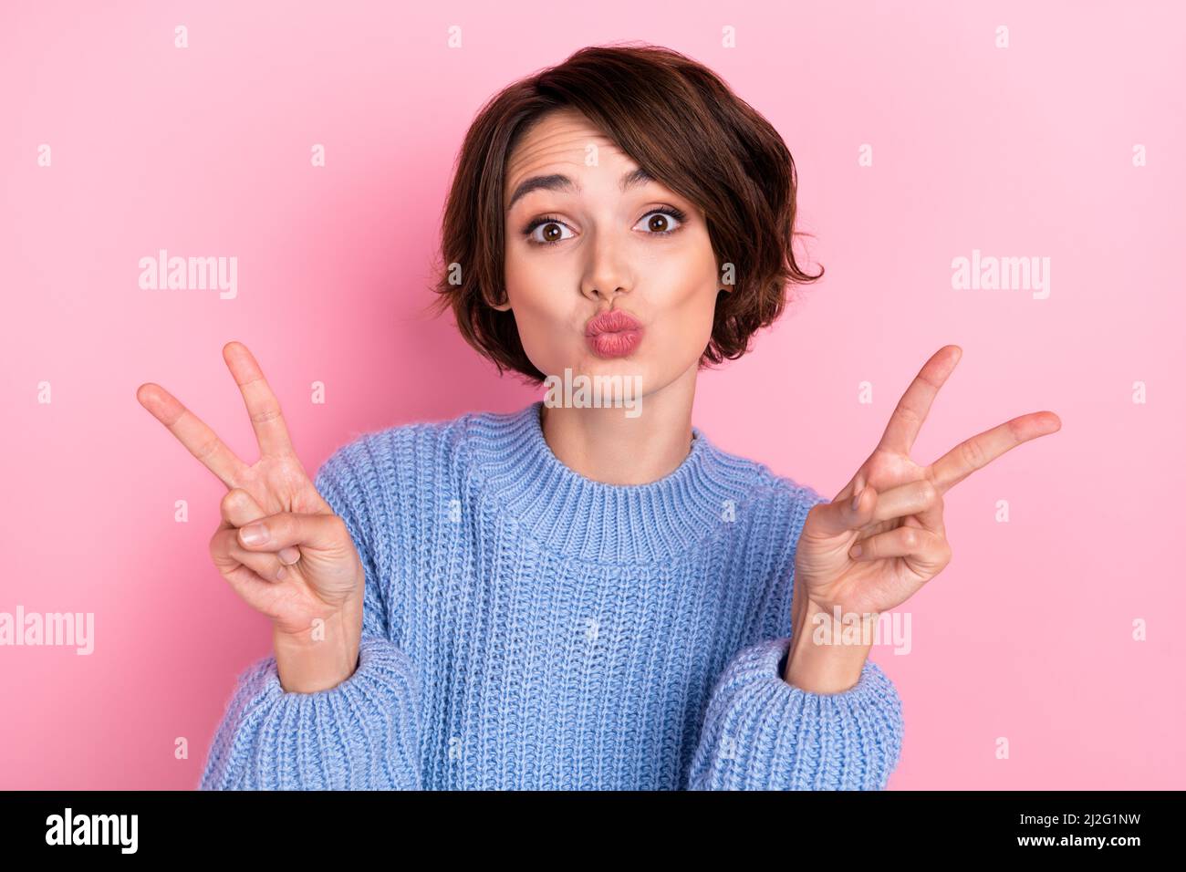 Photo of adorable humorous woman pout lips kiss showing v-sign date ...