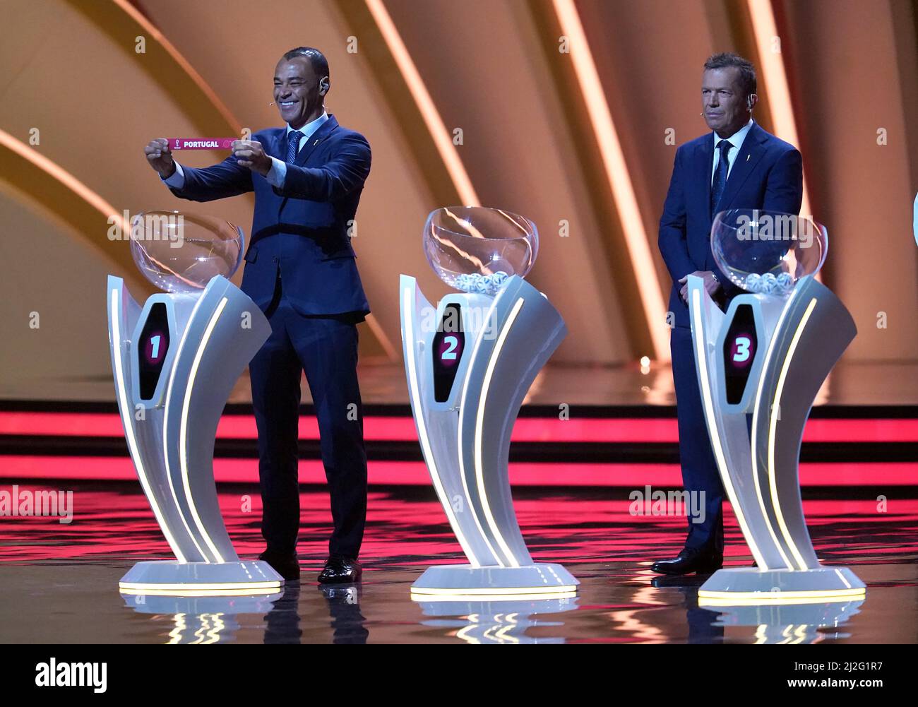 Cafu holds up Portugal after drawing them out of Pot 1 during the FIFA ...