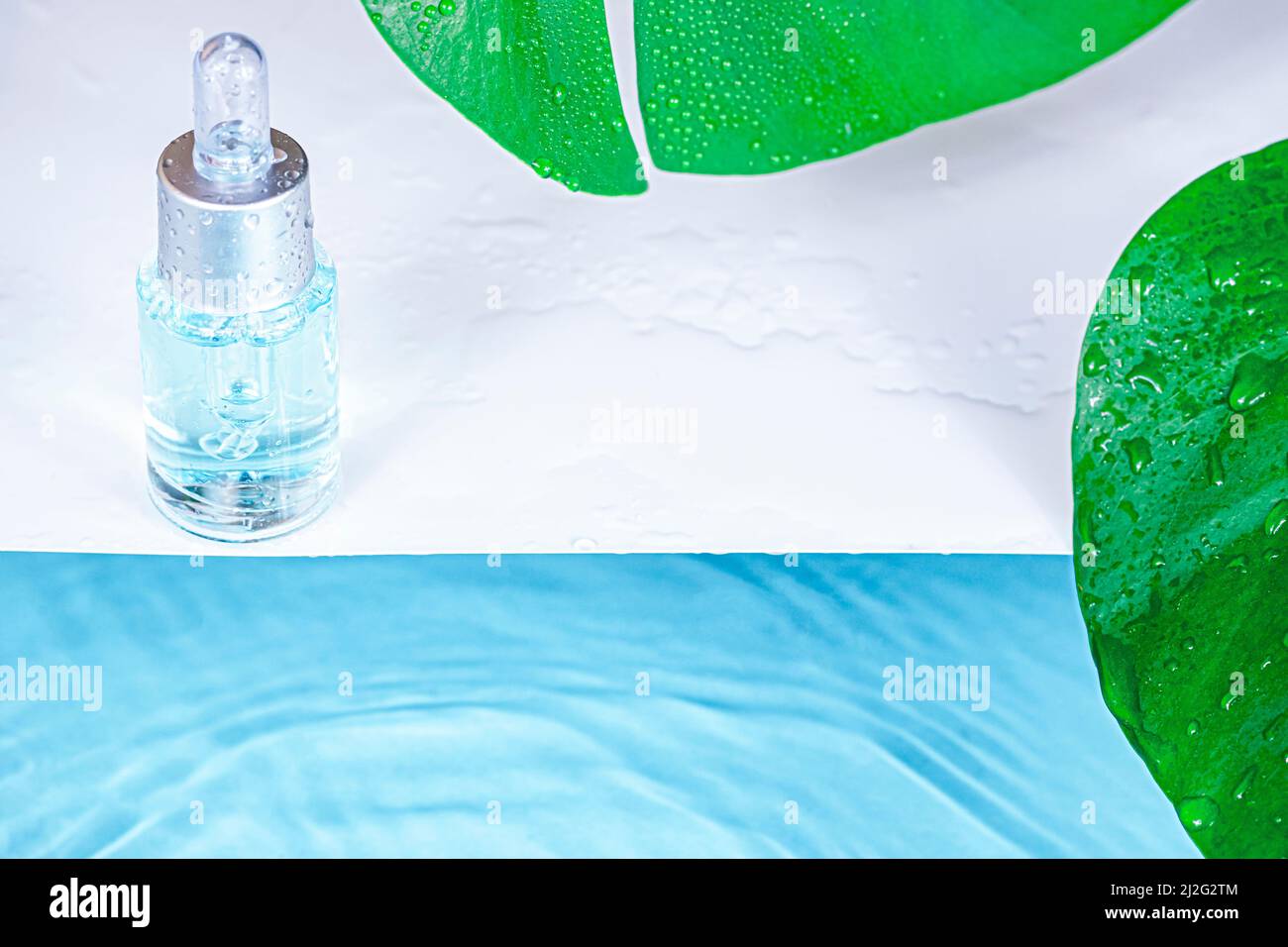 Bottle serum or cosmetic oil on the swimming pool or sea beach ...