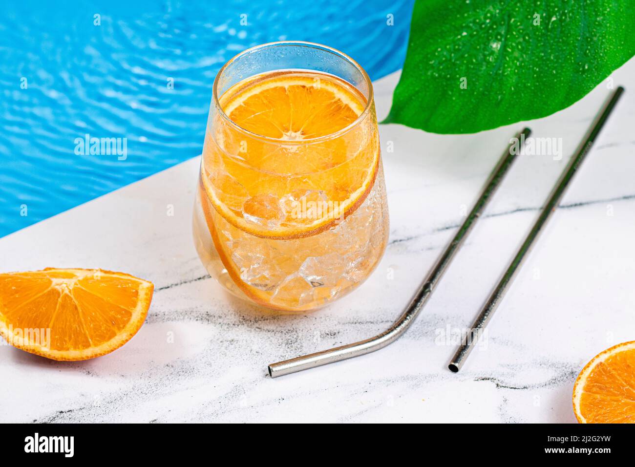 Summer refreshing water with orange slice. Glass of cocktail, orange ...
