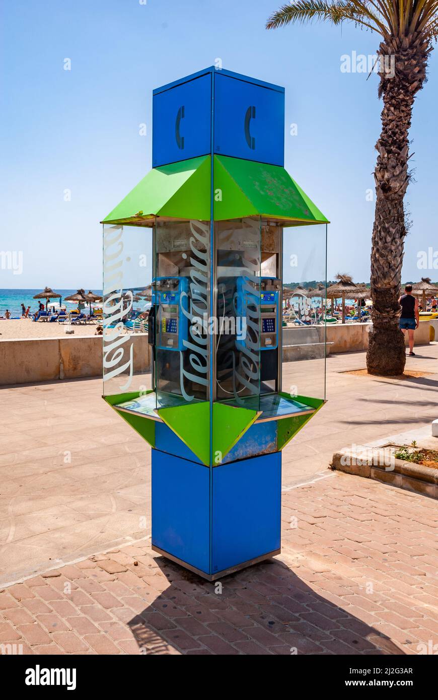 A vertical shot of telefonica telephone station at the beach promenade ...