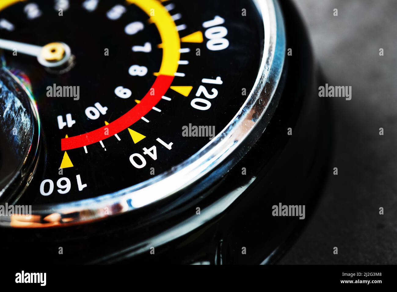 Hand air pump manometer for pressure control on a dark background close ...