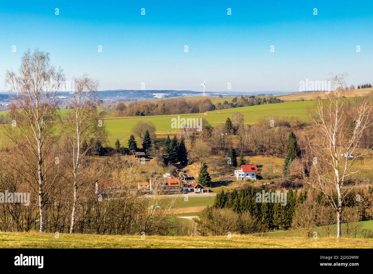 A bright summer day in Thuringia, Germany with houses surrounded by ...