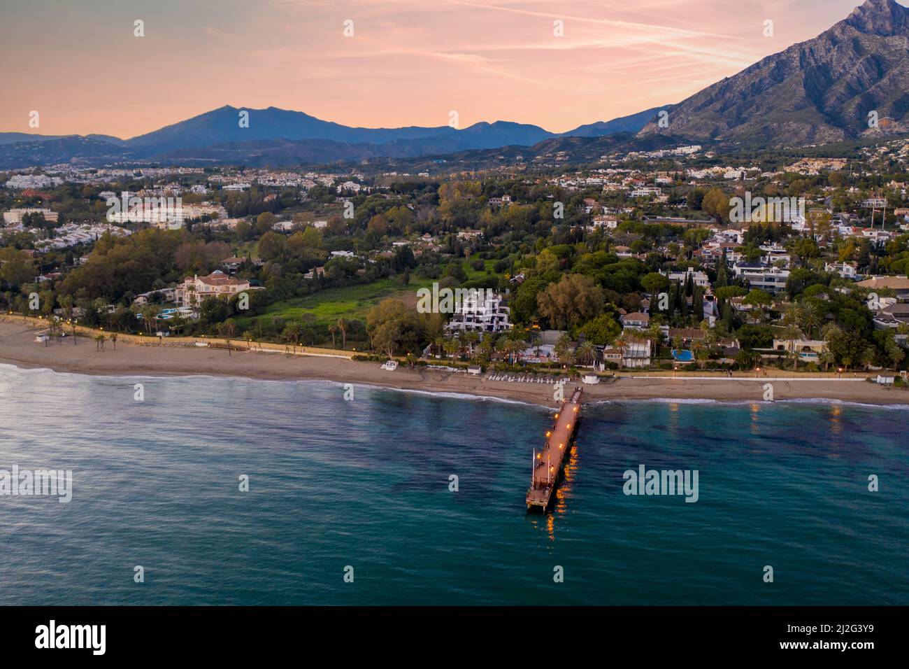 beautiful jetty on a beach in the town of Marbella on the Costa del Sol ...
