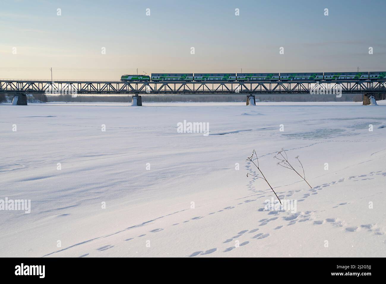 Rovaniemi, Finland - March 17th, 2022: A train passing over a bridge ...