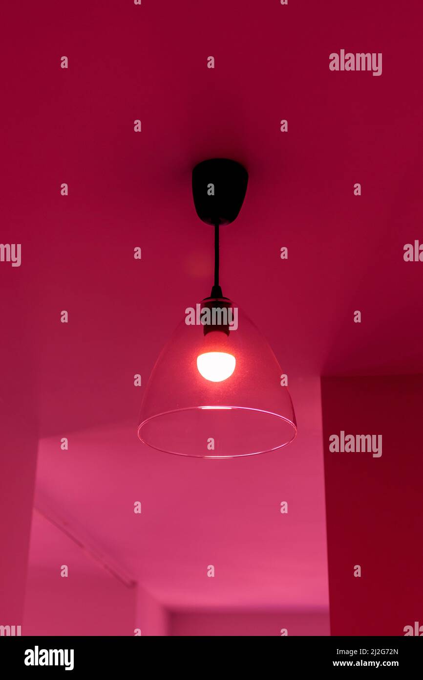 Luminary on the ceiling in the room in the red light Stock Photo - Alamy