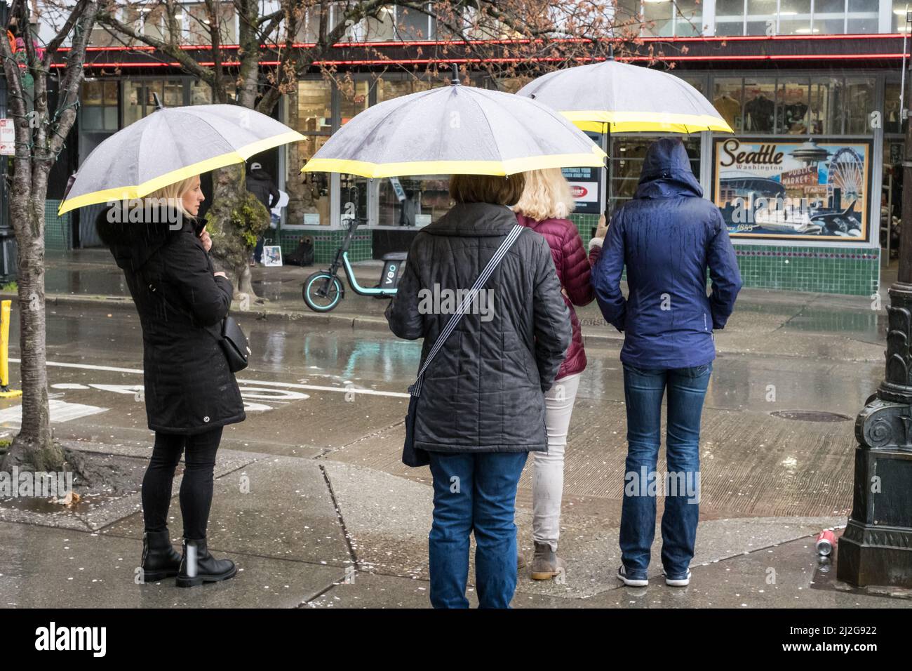 Seattle, USA. 30th Mar, 2022. Pike Place Market as a rain storm moves ...