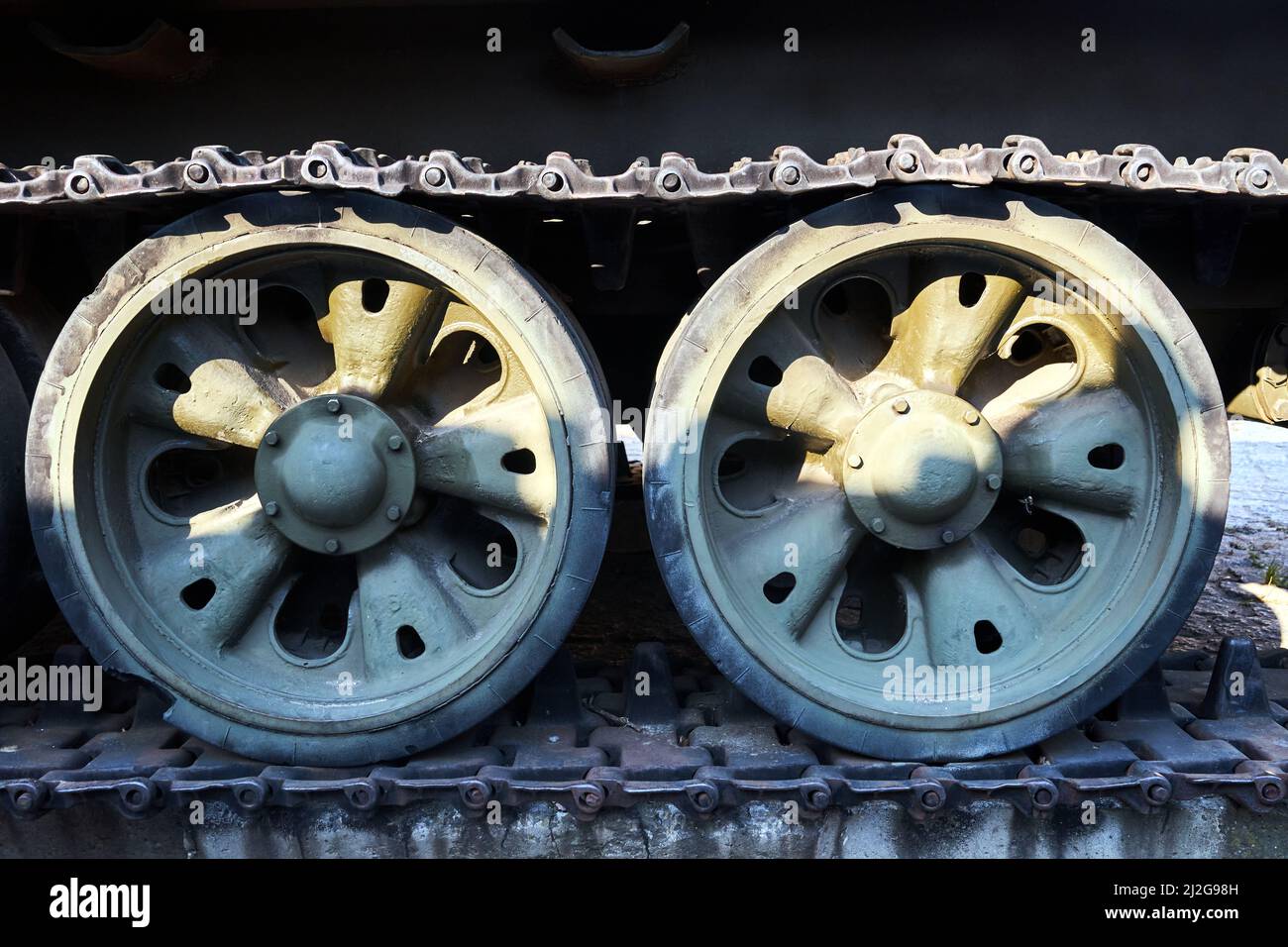 A caterpillar and road wheels of a historic Soviet tank from World War ...