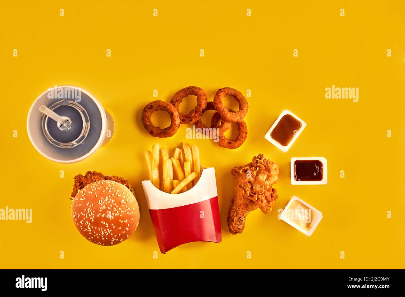 Fast food dish top view. Meat burger, potato chips and chicken. Take ...