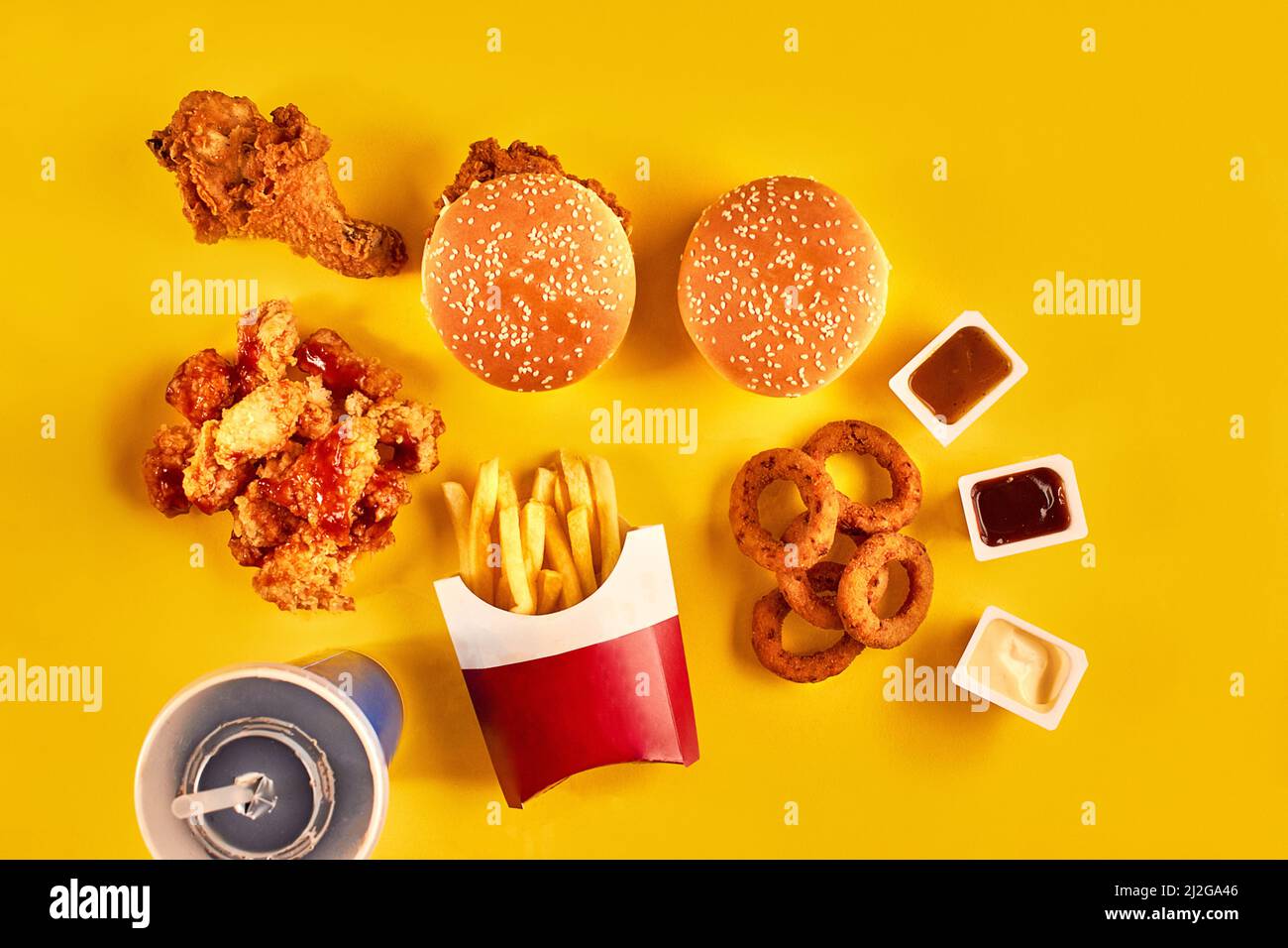 Fast food dish top view. Meat burger, potato chips and chicken. Take ...