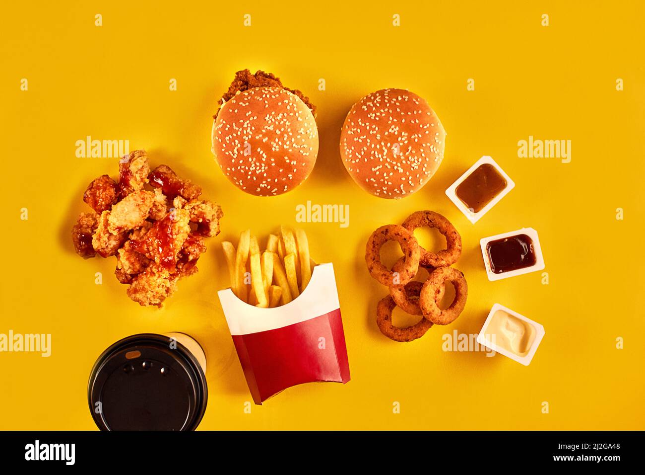 Fast food dish top view. Meat burger, potato chips and chicken. Take ...