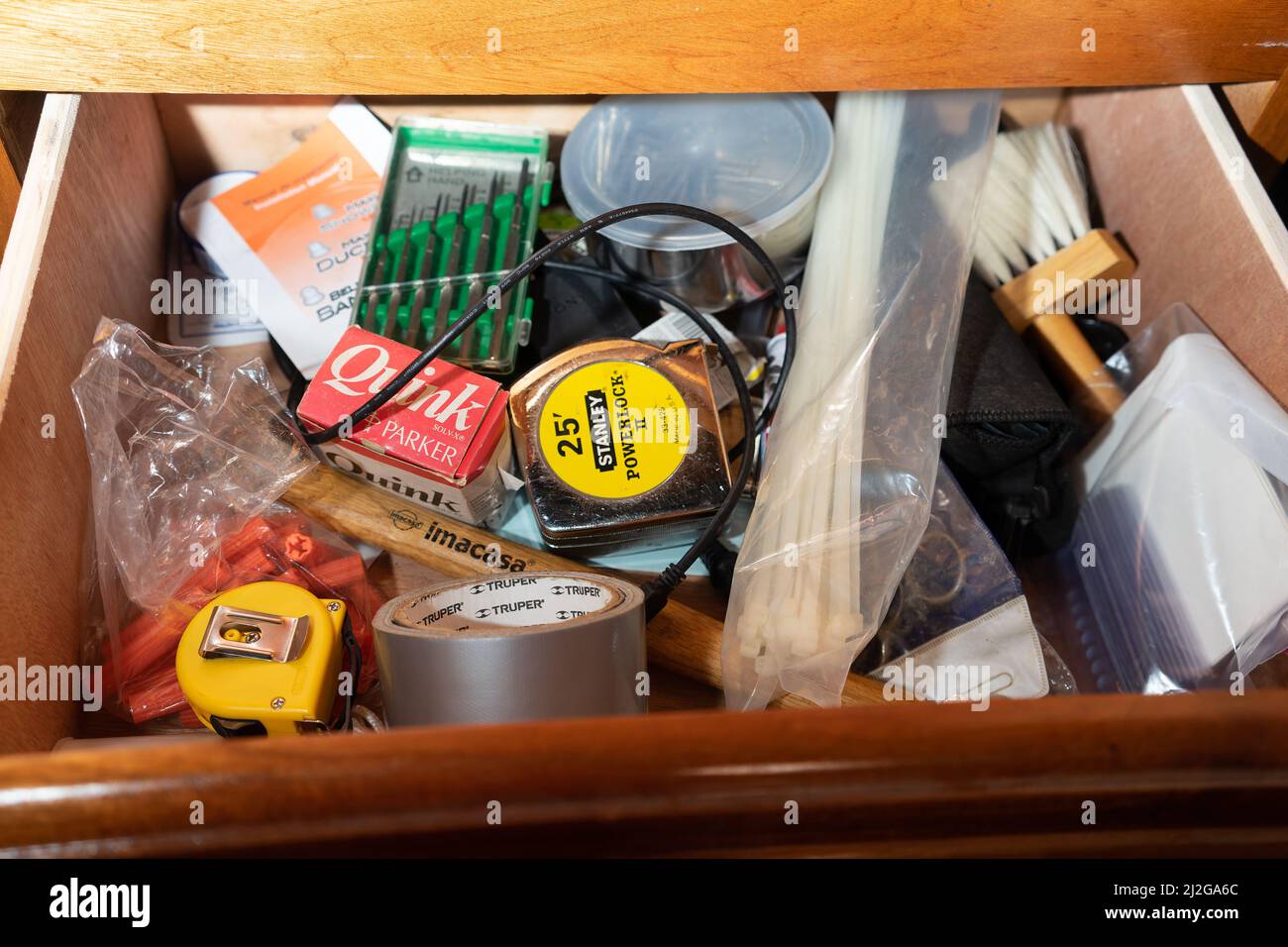 Random stuff drawer, mostly small tools, zip ties, measuring tapes, and ...
