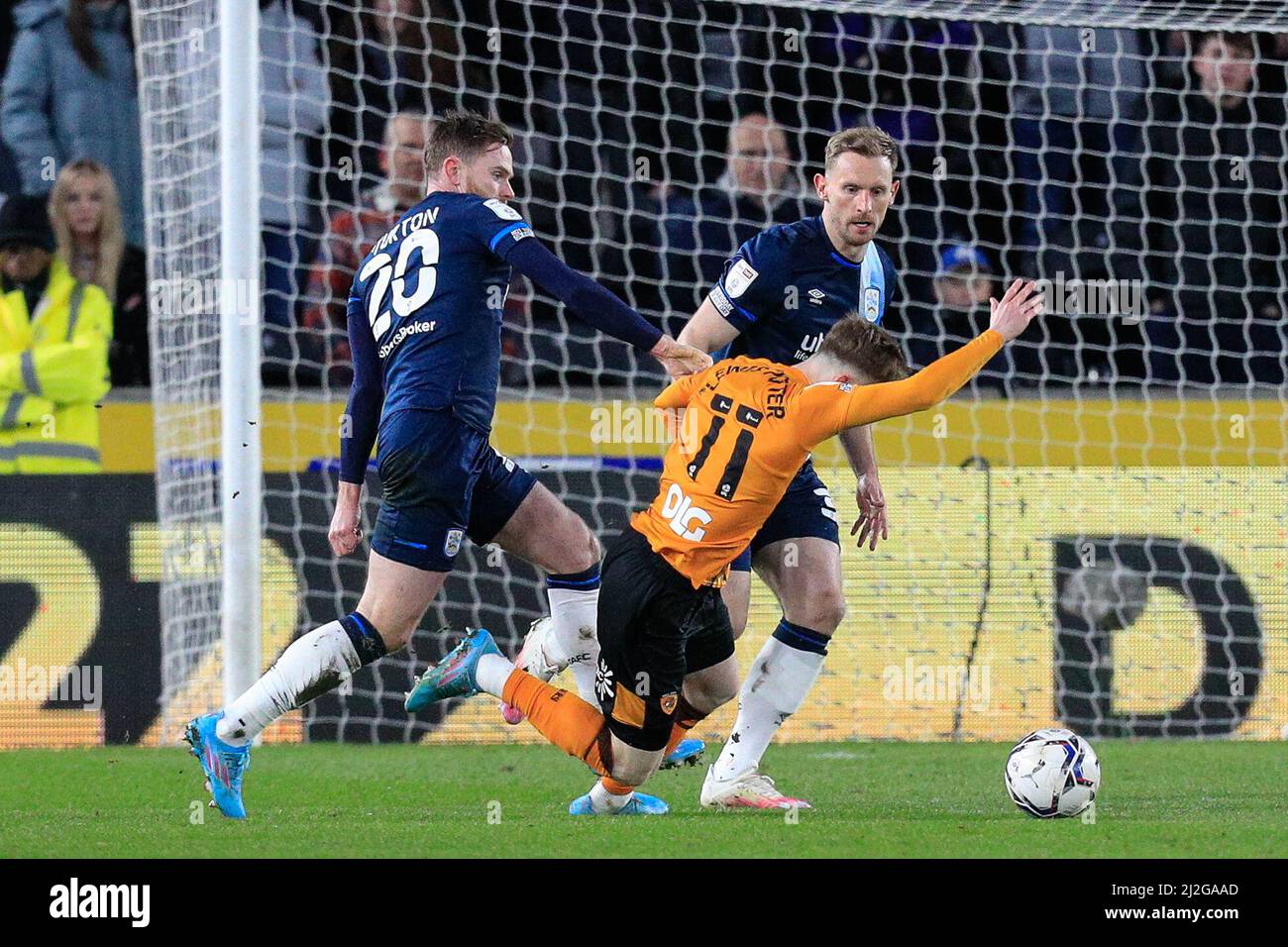 Keane Lewis-Potter #11 of Hull City is fouled by Oliver Turton #20 of ...