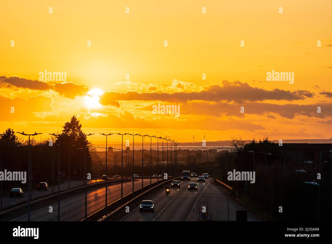 Sunset over traffic on the Thanet Way, A299, an English dual ...