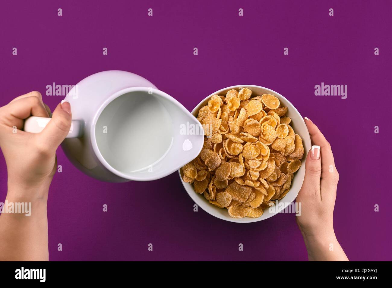 Food and people concept - hands of woman eating cereals corn flakes for ...