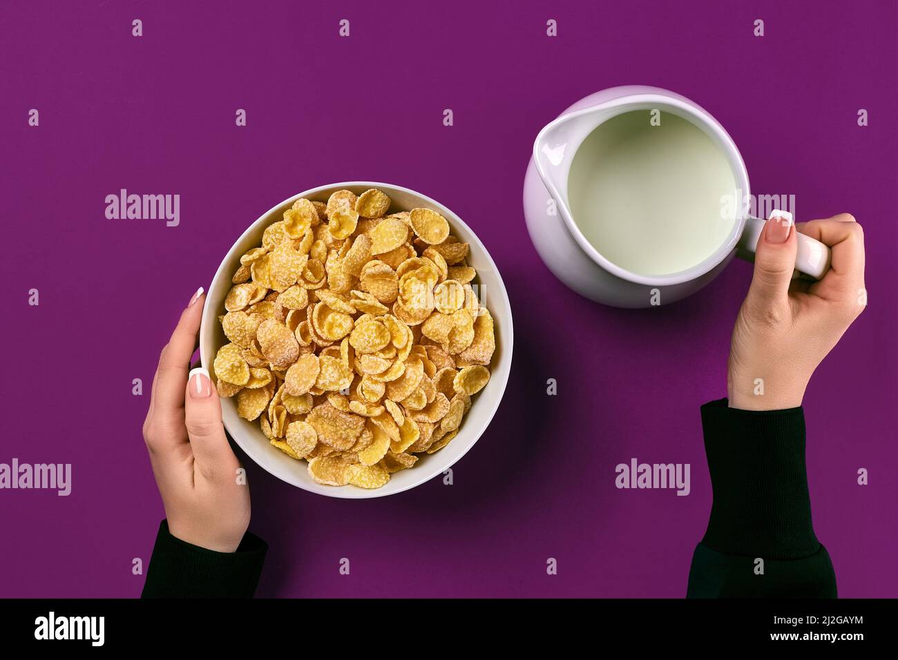 Food and people concept - hands of woman eating cereals corn flakes for ...
