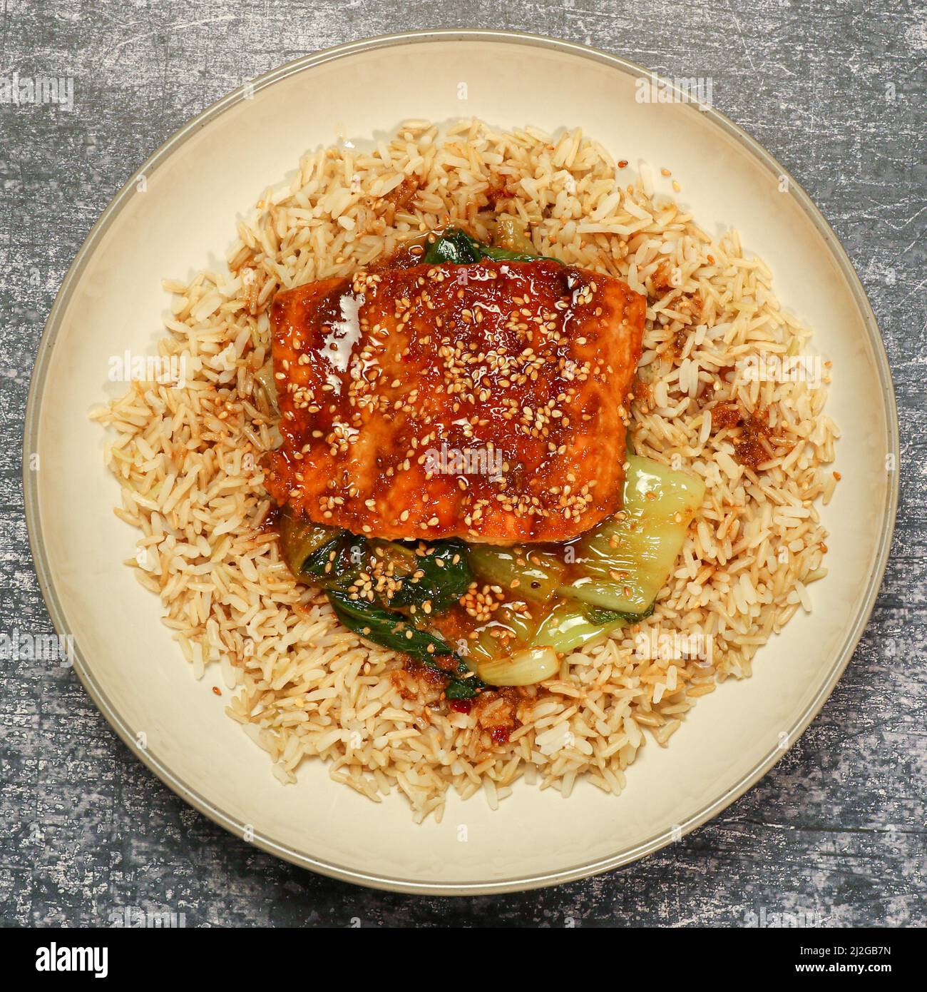 Teriyaki salmon with sesame pak choi from above Stock Photo - Alamy
