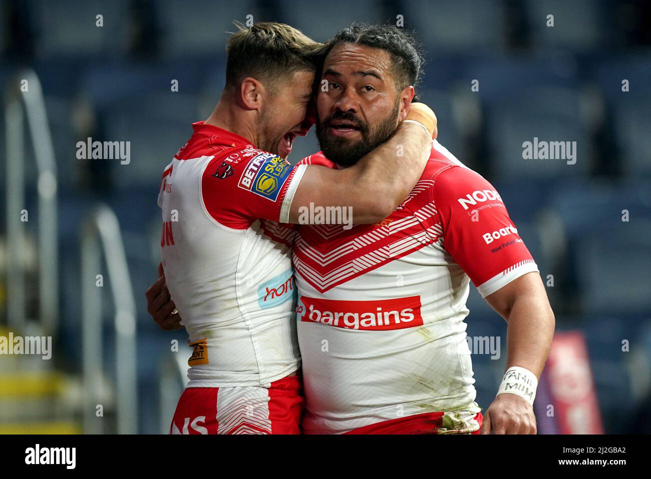 St Helens' Konrad Hurrell (right) celebrates scoring his side's first ...