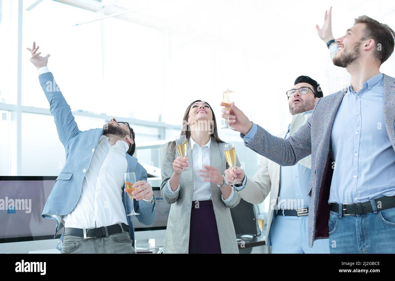 group of happy employees celebrate their success in the workplace Stock ...