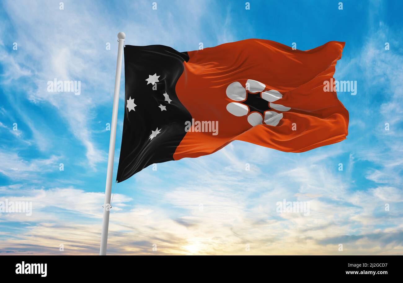 flag of Northern Territory , Australia at cloudy sky background on ...