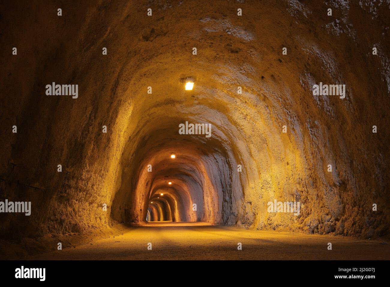 Beautiful tunnel cave with illumination in Montenegro Stock Photo - Alamy