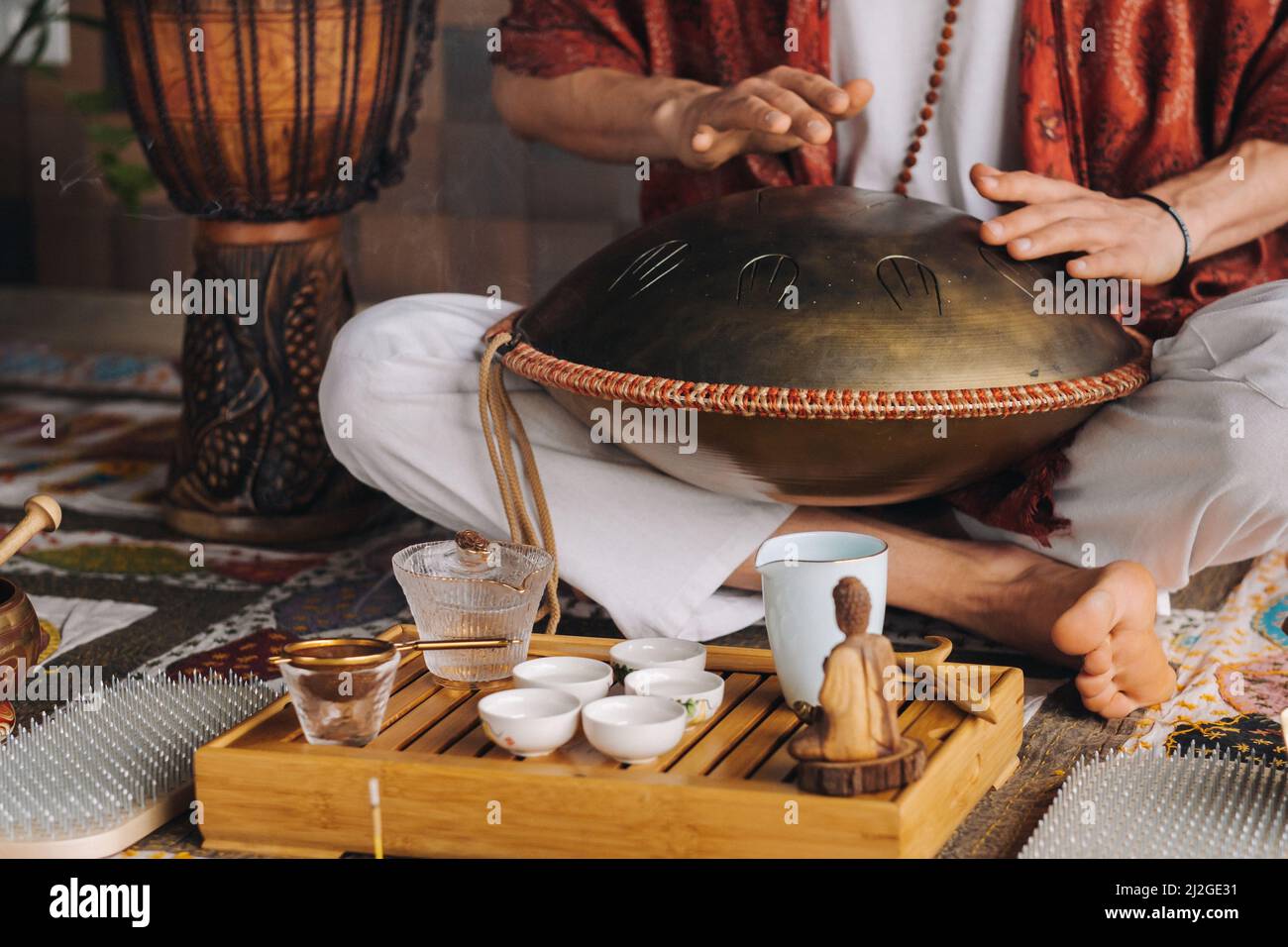 Close-up of a man's hand playing a modern musical instrument - the ...