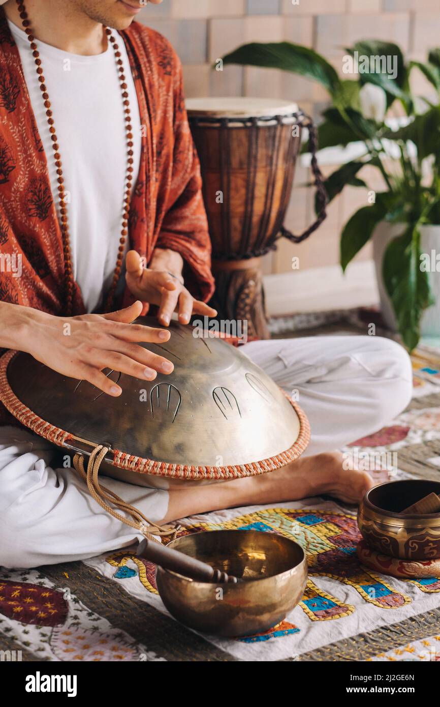 Close-up of a man's hand playing a modern musical instrument, the orion ...