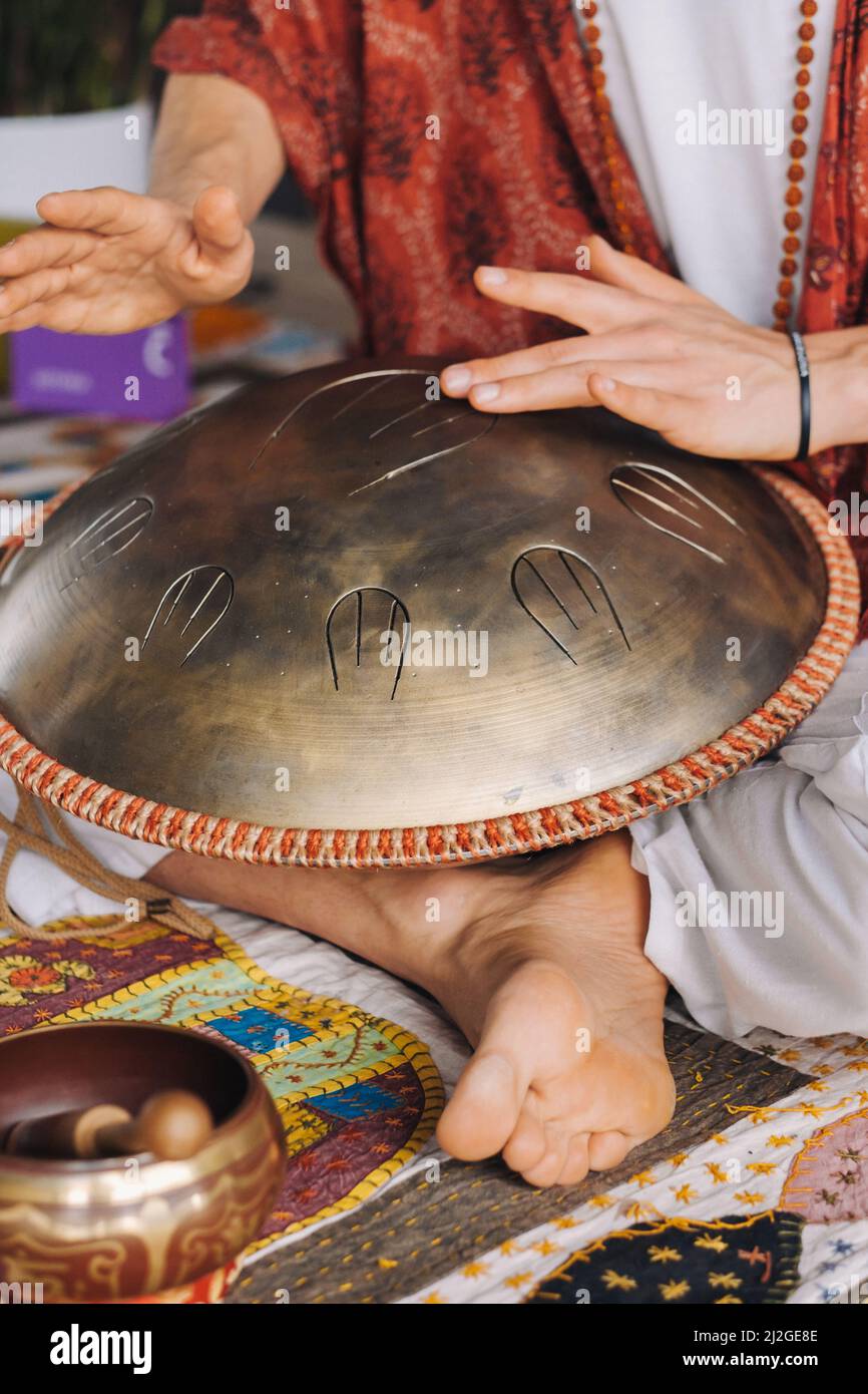 Close-up of a man's hand playing a modern musical instrument, the orion ...