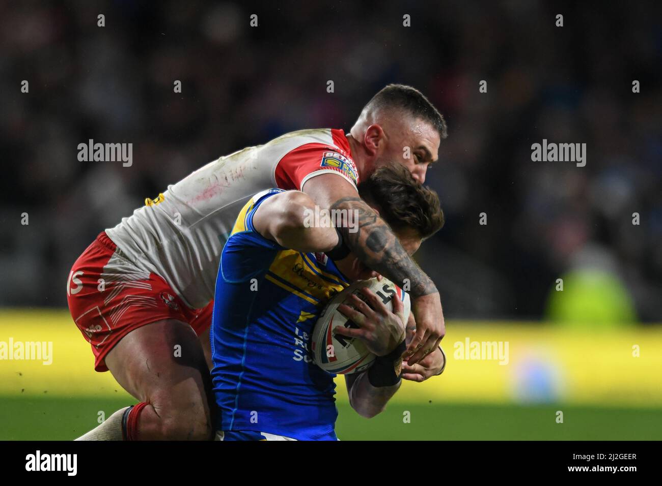 Curtis Sironen #16 of St Helens does a high tackle on James Donaldson ...