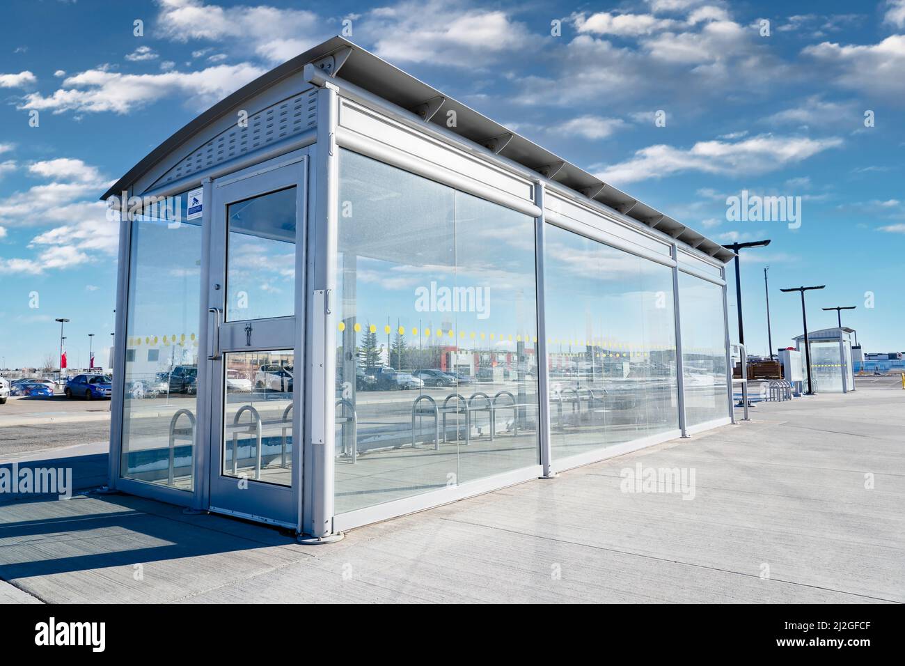 A public transit bus shelter at a municipal transfer station for urban ...