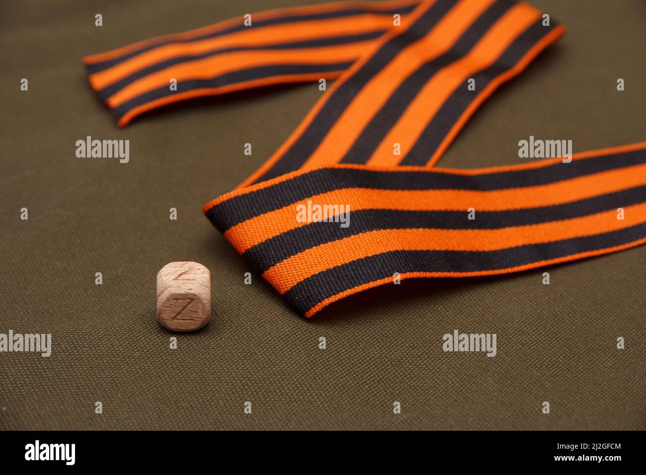 The letter z from the St. George ribbon on a background of green army ...